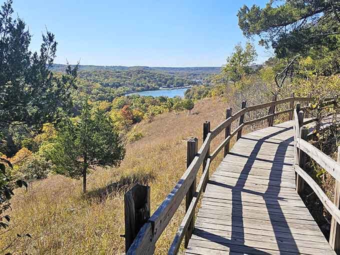That wooden boardwalk leading to a limestone tower? That's your yellow brick road to Missouri's most unexpected castle.