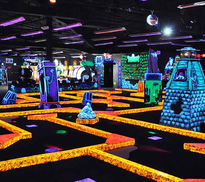 Enter a space where geometry and the supernatural collide, and every angle shines beneath blacklight magic.