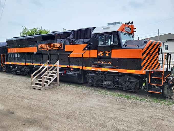 That striking orange and black locomotive isn't just for show, it's a working piece of railroad history.