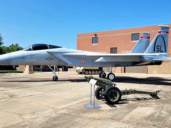 Fighter jets and artillery create a striking contrast against Missouri's blue skies, like a time-traveling military parade frozen in place.