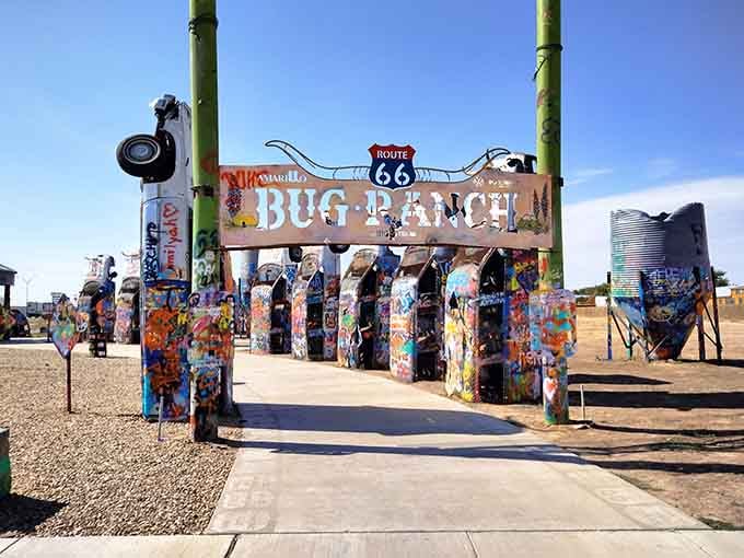 The Bug Ranch entrance arch welcomes you to automotive art paradise where spray paint meets Route 66 nostalgia.
