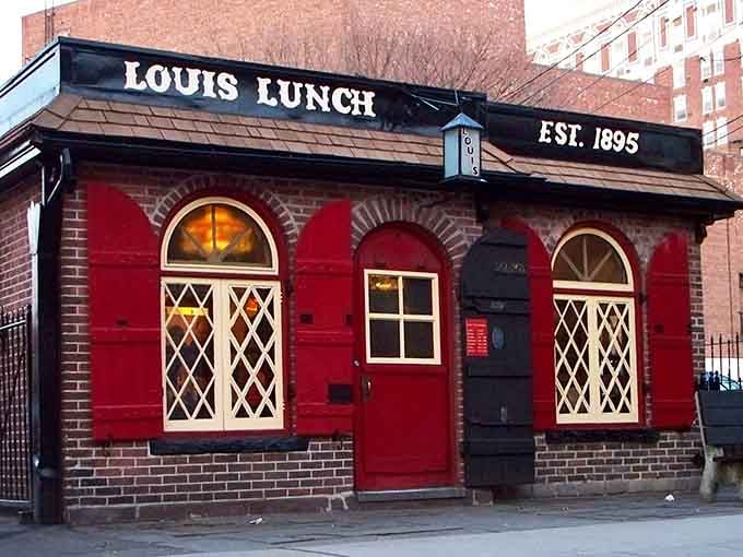 That charming red brick exterior isn't just for show; it's where American burger history literally began cooking.