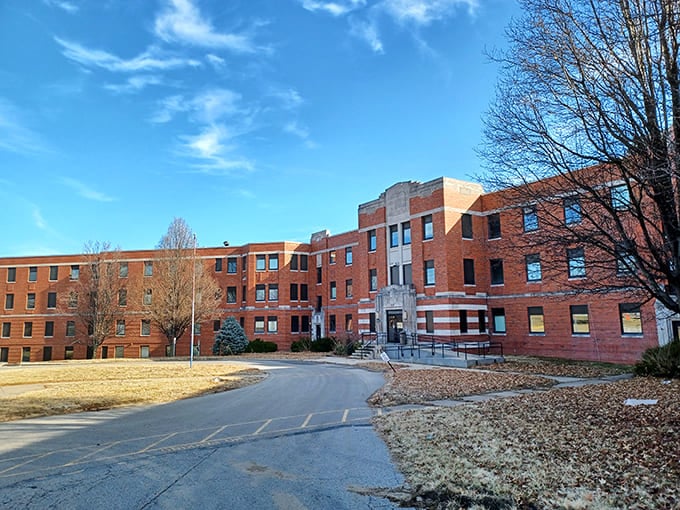 The imposing brick facade of the former State Hospital stands as a powerful reminder of psychiatric care's complex history.