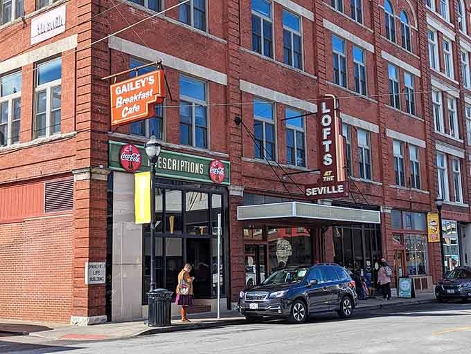 That orange sign against historic brick is your beacon to breakfast bliss in downtown Springfield's heart.
