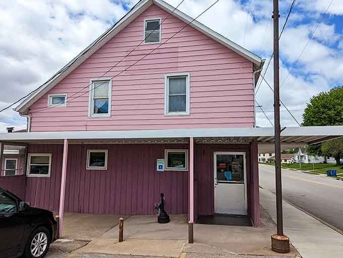 That cheerful pink exterior isn't just paint—it's a promise of the homemade goodness waiting inside this beloved diner.