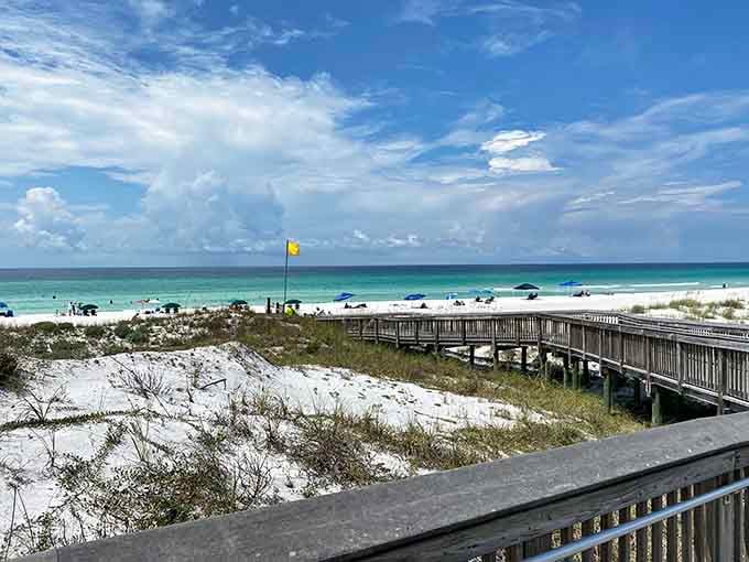 The boardwalk to paradise looks exactly like this, complete with sugar-white dunes and that impossible turquoise horizon.