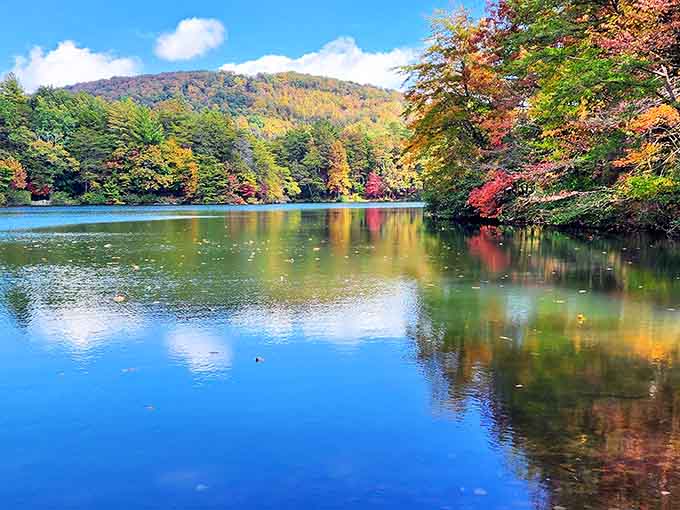Fall colors reflecting on the lake create a mirror image so perfect it'll mess with your sense of reality.