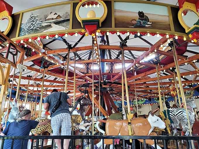 Hand-carved creatures circle endlessly in this Nederland treasure, where artistry meets pure childhood wonder in wooden form.