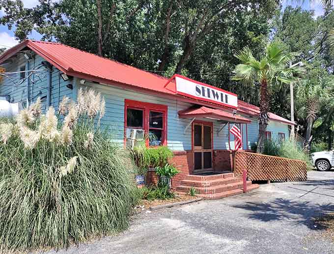 That white exterior with the red roof isn't just charming, it's practically a beacon calling hungry travelers home.
