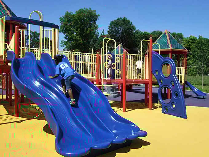 Those blue slides aren't messing around, delivering the kind of speed that makes kids squeal with delight and parents grateful for soft landings.