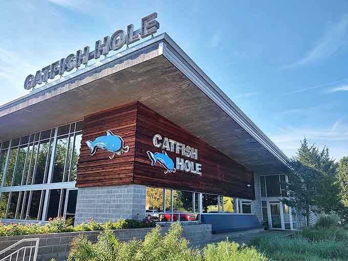 The modern exterior of Catfish Hole blends rustic wood with contemporary design, welcoming hungry visitors to Alma's seafood destination.
