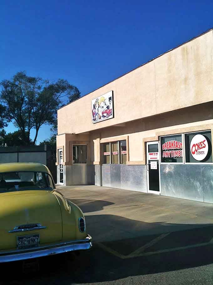 A vintage yellow car perfectly complements this throwback diner experience. It's like the universe arranged this scene specifically for nostalgic breakfast enthusiasts.