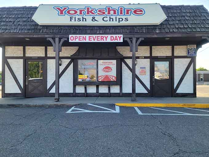 The Tudor-style facade of Yorkshire Fish & Chips stands like a British embassy on Denver soil, promising authentic flavors beneath its distinctive black-and-white timber framing.