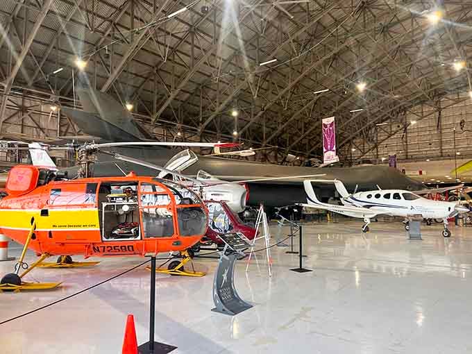 A diverse collection of aircraft, from helicopters to sleek jets—this hangar is a haven for aviation enthusiasts.
