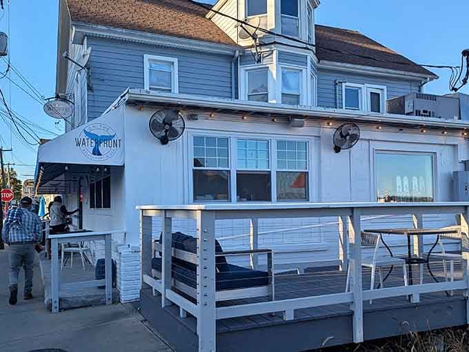 The restaurant's classic New England architecture whispers "maritime heritage" while the outdoor seating practically shouts "summer evening perfection."