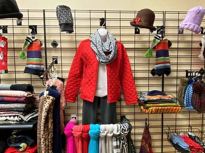 Winter fashion that doesn't require a trust fund! This perfectly styled mannequin showcases how a pop of red can transform your cold-weather wardrobe without freezing your bank account.