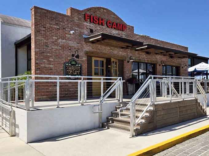 The welcoming brick exterior of St. Augustine Fish Camp, where unpretentious architecture houses seafood excellence within.