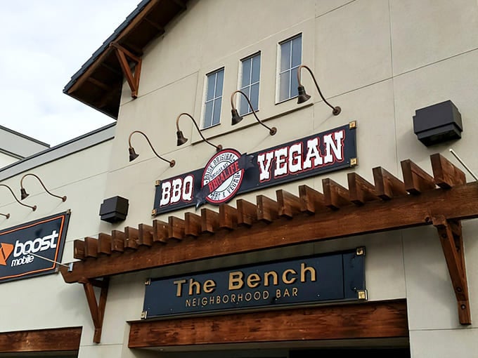 The unassuming storefront speaks volumes: "BBQ" on one side, "VEGAN" on the other. It's like finding a unicorn that makes excellent brisket.