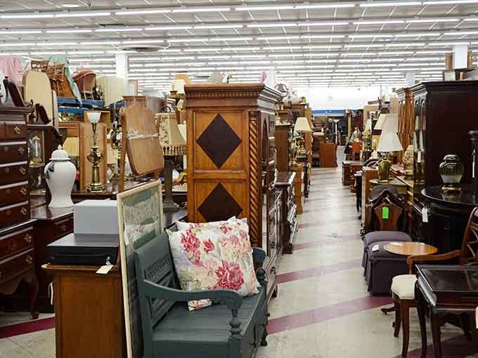 A furniture wonderland where vintage armoires stand like sentinels guarding treasures from decades past. Every aisle tells a different story.