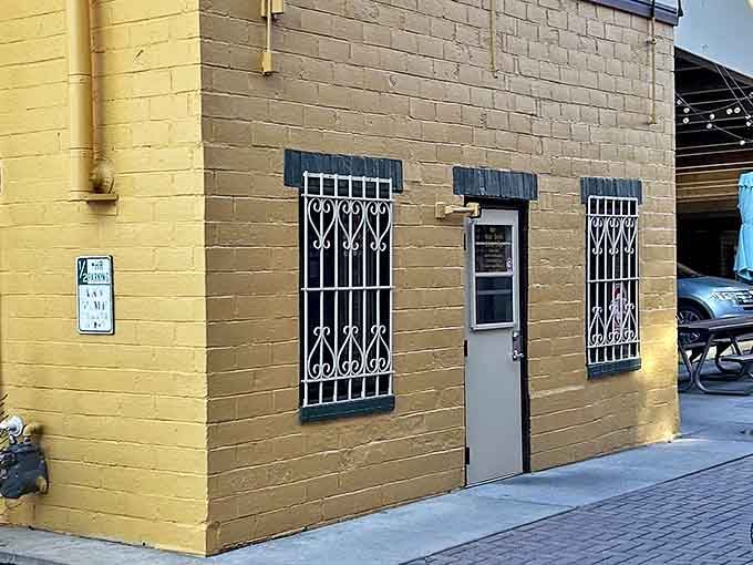 The unassuming yellow brick exterior of Canteen Lunch in the Alley proves once again that culinary treasures often hide in plain sight.