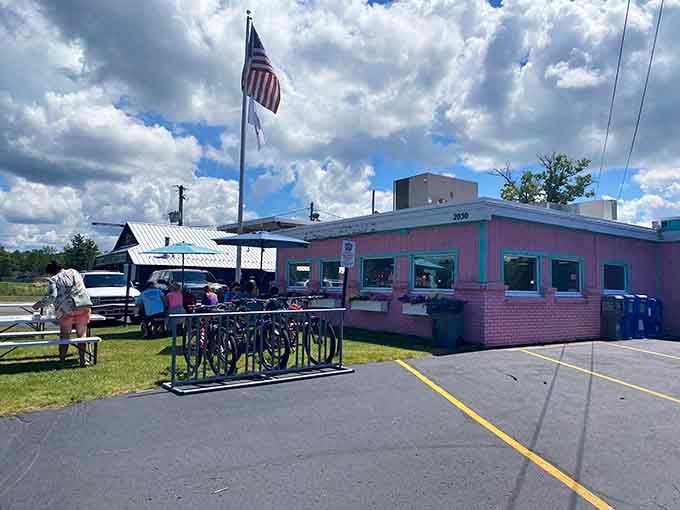 That pink-and-turquoise exterior isn't whispering, it's belting out a full Broadway number about milkshakes and nostalgia.
