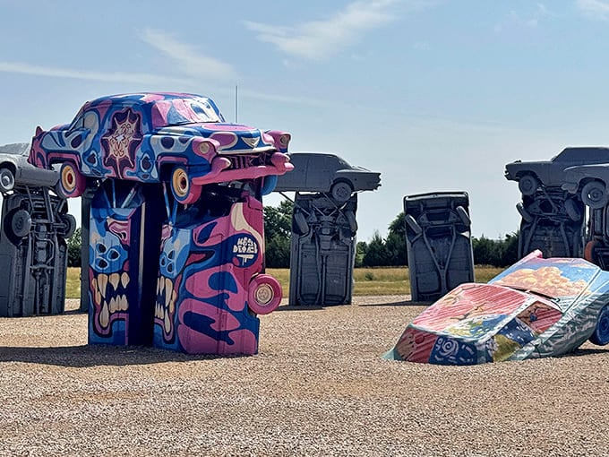 The automotive Stonehenge rises from the Nebraska prairie like a Detroit-inspired dream, where classic American cars reach for the sky instead of cruising highways.