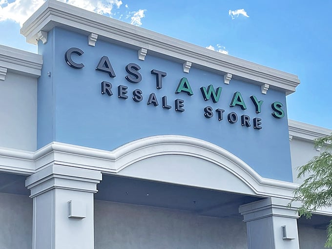 The inviting blue fa&ccedil;ade of Castaways Resale Store stands against the Nevada sky, promising treasures within for bargain hunters.