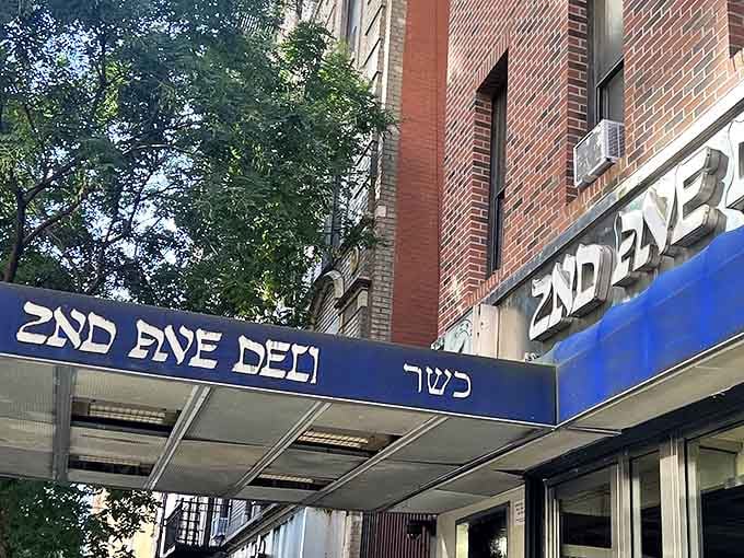 New York sidewalk, classic deli signage &ndash; some landmarks don't need to shout to be heard above the city's constant symphony.