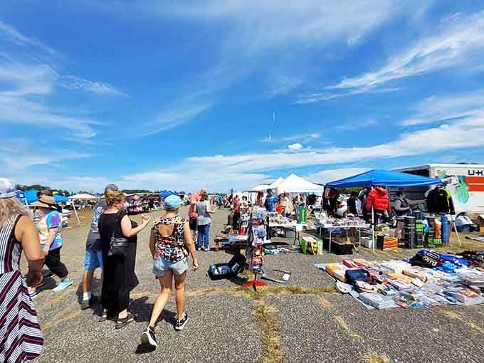 White tents stretching toward the horizon under blue skies, where treasure hunters gather for the ultimate shopping adventure.
