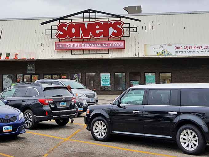 Even on cloudy days, the bright red Savers sign stands out like a beacon, drawing in shoppers who understand that "pre-loved" doesn't mean "second best."