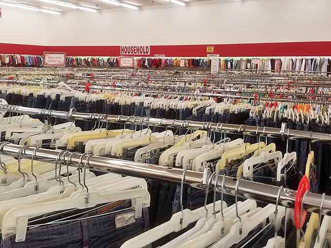 A sea of meticulously organized clothing racks stretches toward the horizon, each hanger potentially hiding that perfect vintage find you didn't know you needed.