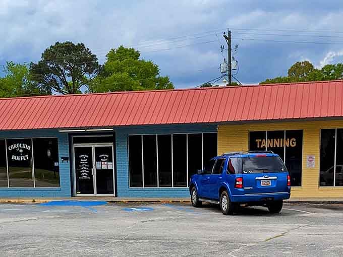 That cheerful blue exterior with the red roof is your beacon to buffet bliss in West Columbia.