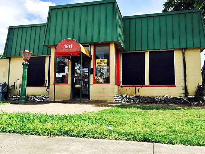 The unassuming green-roofed exterior of Enchiladas Y Mas stands as a beacon of hope for authentic Tex-Mex seekers amid Austin's sea of pretenders.