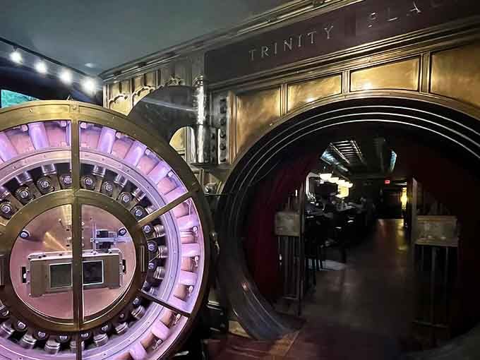 Walking through this authentic bank vault door feels like stepping into a heist movie, except you're heading to dinner instead of stealing millions.