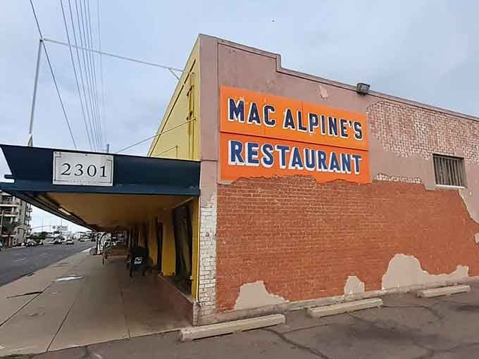 That orange and blue sign isn't just announcing a restaurant; it's declaring a time machine open for business.