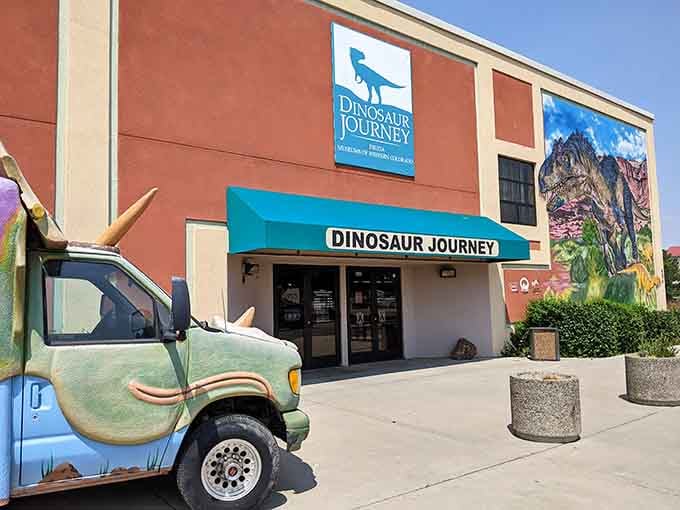 That colorful dinosaur mural practically roars "park here" louder than any GPS ever could.