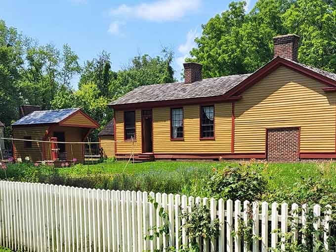 This tidy yellow homestead behind a white picket fence feels like a Norman Rockwell daydream come alive.