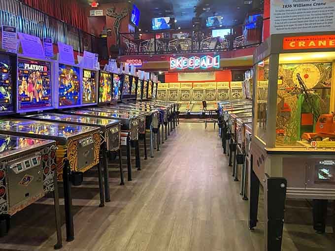 Rows of classic pinball machines stretch as far as the eye can see, creating the ultimate playground for arcade enthusiasts everywhere.