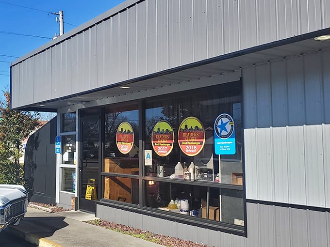 Award badges proudly displayed in the window tell the story before you even step inside &ndash; these burgers have earned their legendary status through decades of consistent excellence.