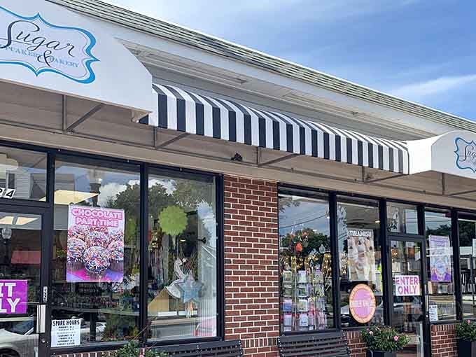 That classic striped awning isn't just charming, it's practically waving you inside for something sweet and wonderful.