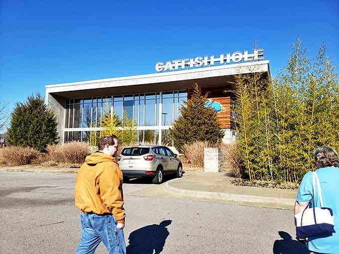 Eager diners approach the Catfish Hole, where legendary hush puppies and perfectly fried catfish await inside this Arkansas institution.