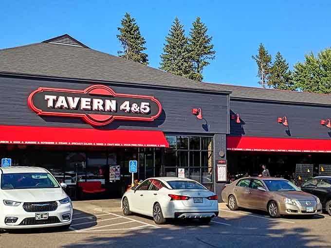 That charcoal gray exterior with the bold red awning is your first clue that breakfast magic awaits inside.