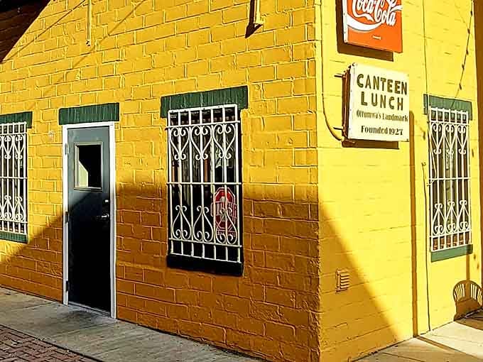 Sunshine bathes the iconic yellow fa&ccedil;ade, where the vintage Coca-Cola sign and metal-grated windows have welcomed hungry Iowans for generations.