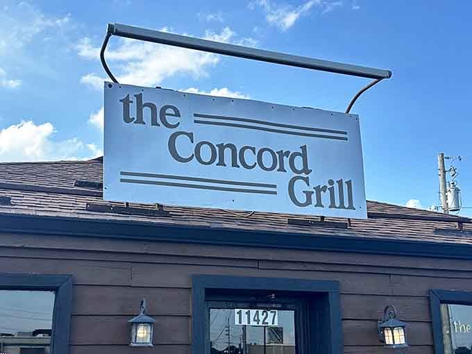 The Concord Grill's unassuming rooftop sign stands like a beacon of comfort food promise against the Missouri sky—no fancy frills needed when the food speaks volumes.