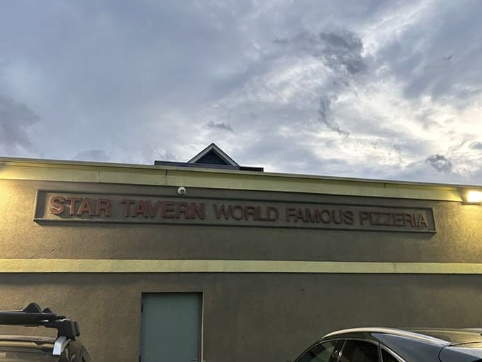 That "World Famous Pizzeria" sign isn't bragging, it's just stating facts under a dramatic New Jersey sky.