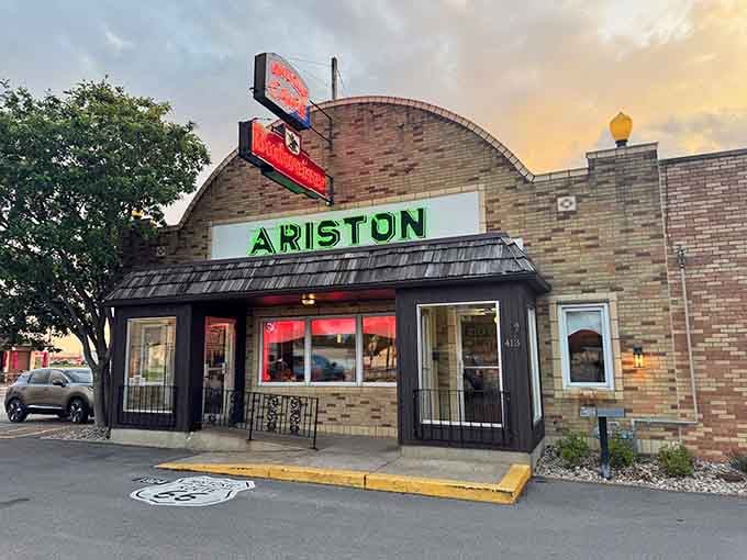 As evening approaches, the Ariston's classic signage lights up like a beacon calling road-weary travelers home to dinner.