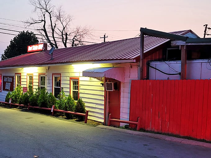 As dusk settles, Red State BBQ's warm glow beckons hungry patrons to discover the smoky delights that have made this joint a local legend.