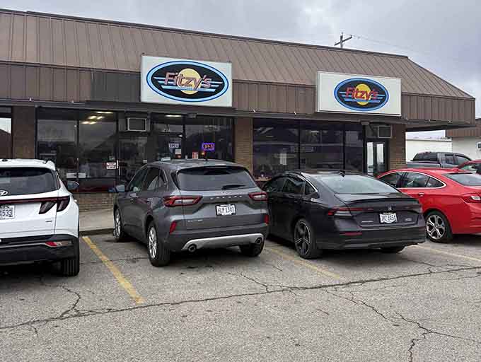 The parking lot tells the story – locals know where to find the good stuff. Fitzy's distinctive blue oval signs promise comfort food salvation.