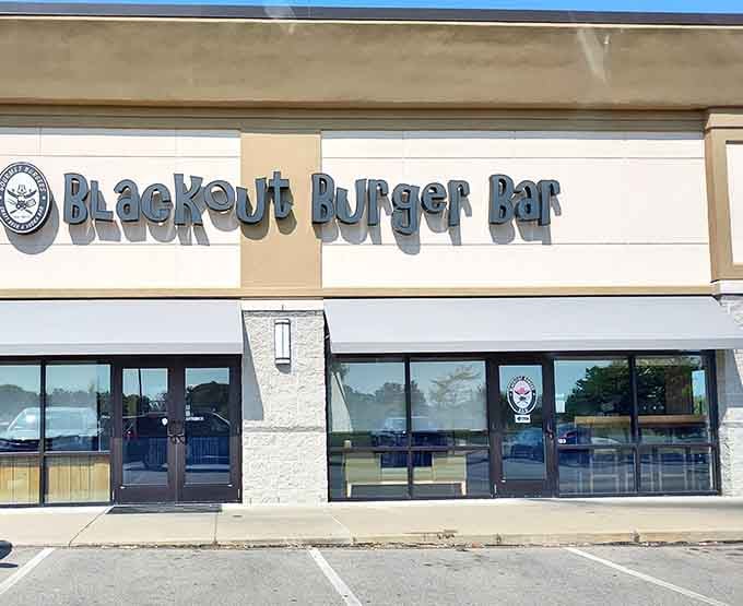 The unassuming exterior of Blackout Burger Bar hides culinary treasures within, like finding a diamond mine disguised as a hardware store.