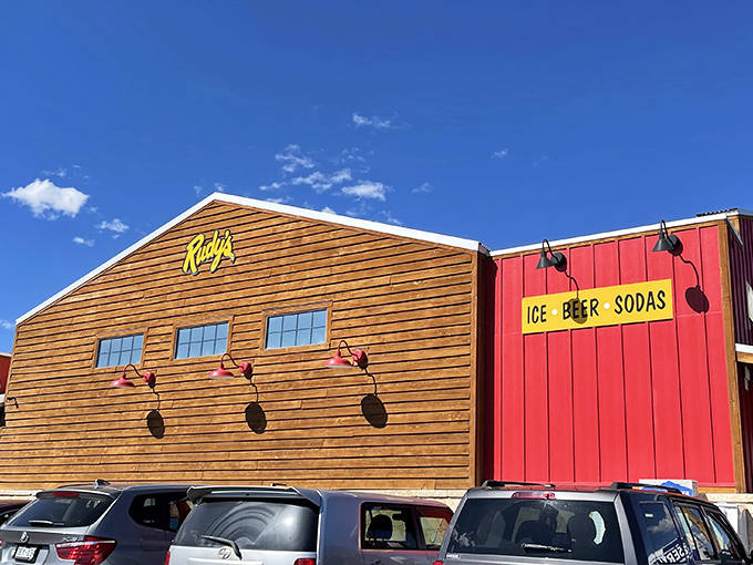 The iconic red exterior of Rudy's beckons like a barbecue lighthouse, promising smoky treasures within those rustic wooden walls.